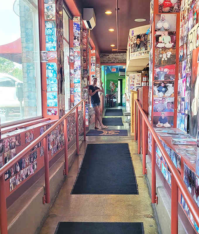 Even the hallway gets the photo treatment, turning a simple walk to your table into a gallery experience.