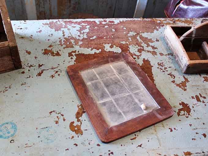Students practiced their letters on slates like this, erasing mistakes with spit and sleeve in pre-iPad classrooms.