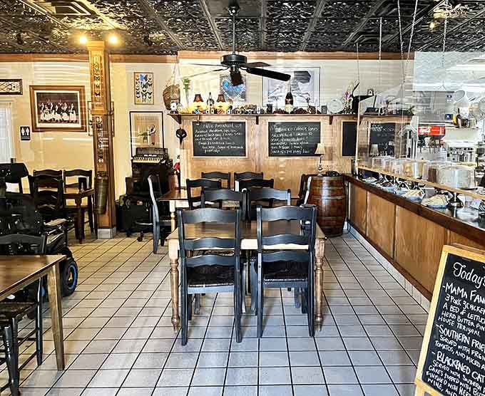 The cozy dining area with its decorative ceiling proves atmosphere matters, even when you're technically eating at a fuel stop.