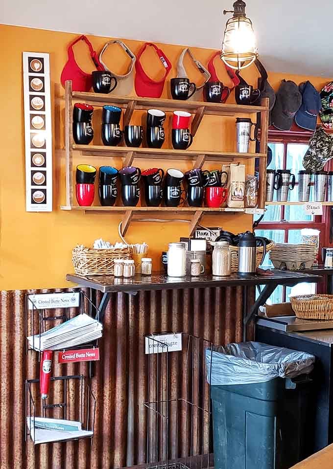 Branded mugs lined up like soldiers, ready to deliver caffeine to the grateful masses of Crested Butte.