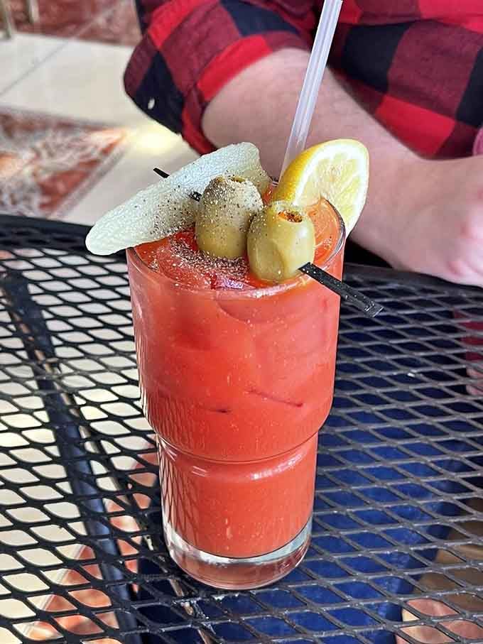 That Bloody Mary comes dressed to impress with pickled garnishes, looking like brunch's answer to a Mediterranean vacation.