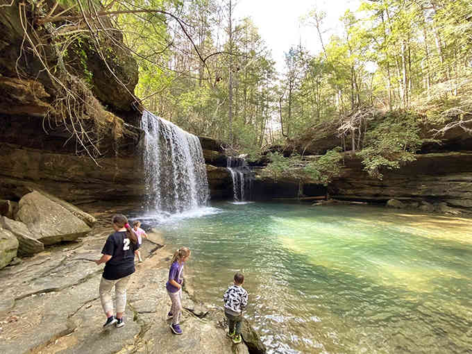 Three generations, one waterfall, and memories being made faster than the water flows.