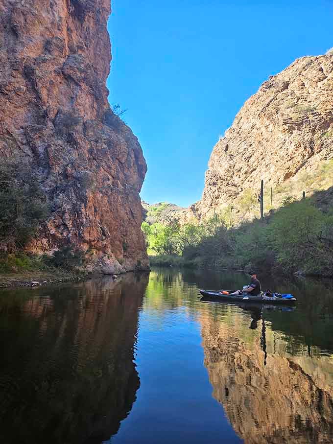Paddling through narrow canyon passages with mirror-perfect reflections feels like discovering your own private slice of wilderness heaven.