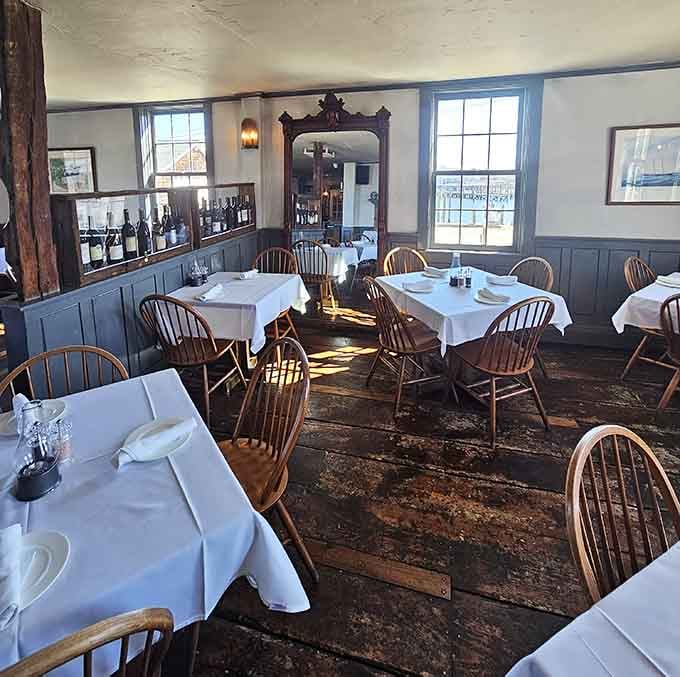 Sunlight streams through historic windows, illuminating a dining room that's witnessed centuries of memorable meals.
