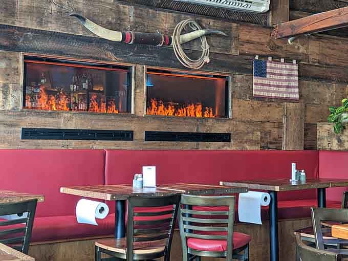 The dining area features warm wood tones and red booths that invite you to settle in and stay awhile.