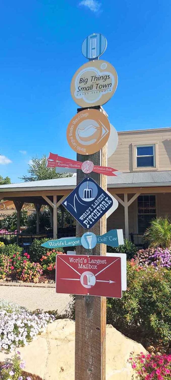 This directional sign points visitors toward Casey's greatest hits, a helpful roadmap to world-record-breaking wonders nearby.