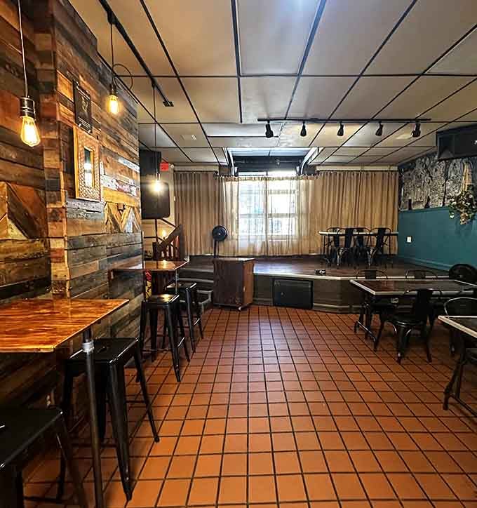 A back room featuring eclectic wall art and game tables, because great hangout spots need multiple dimensions.