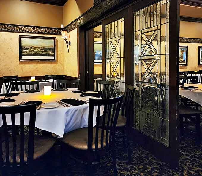 Elegant dining spaces with decorative glass partitions that create intimacy without feeling closed off or cramped.