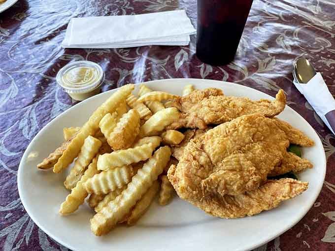 Golden chicken strips and waffle fries: comfort food that never goes out of style, no matter the decade.