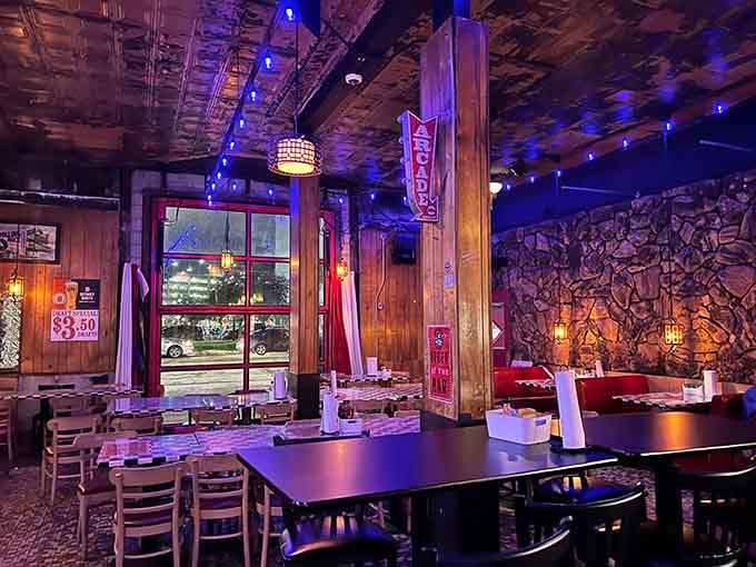 Blue mood lighting transforms the space into something magical, like stepping into your favorite childhood arcade after dark.