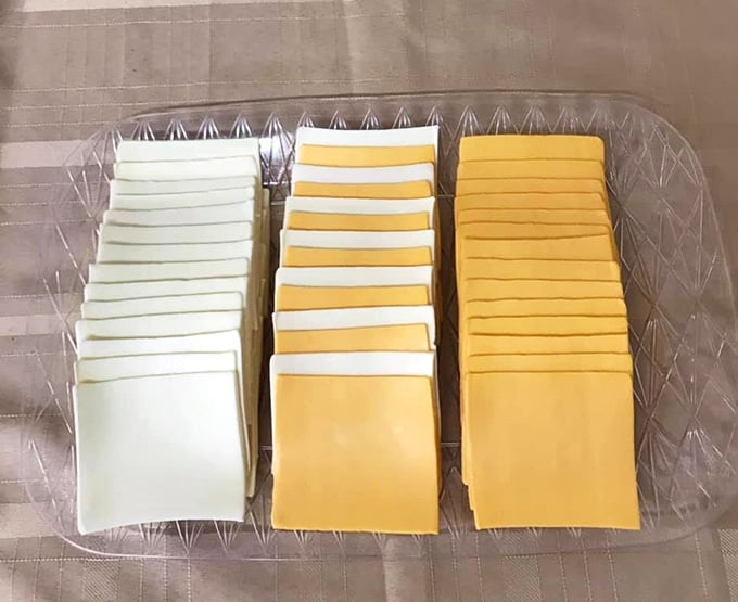 Perfectly sliced processed cheese proves that sometimes the classics deserve space alongside the gourmet selections.