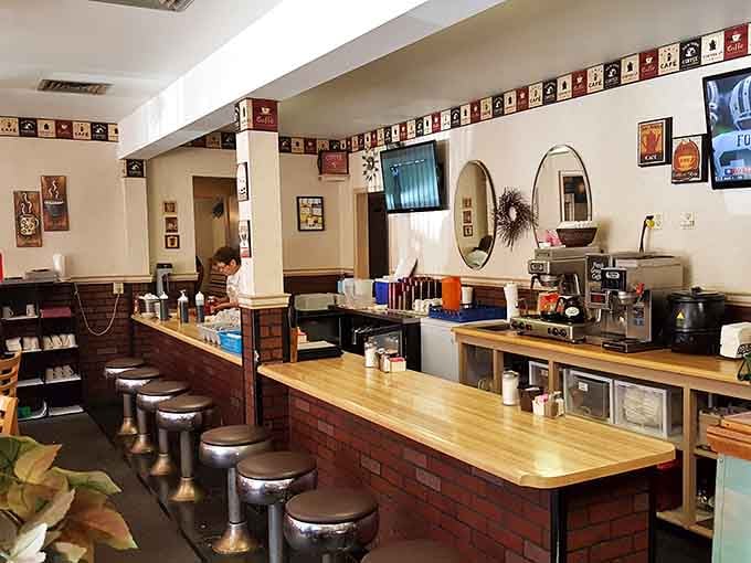 Classic diner counter seating with swivel stools invites solo diners to settle in with coffee and conversation.