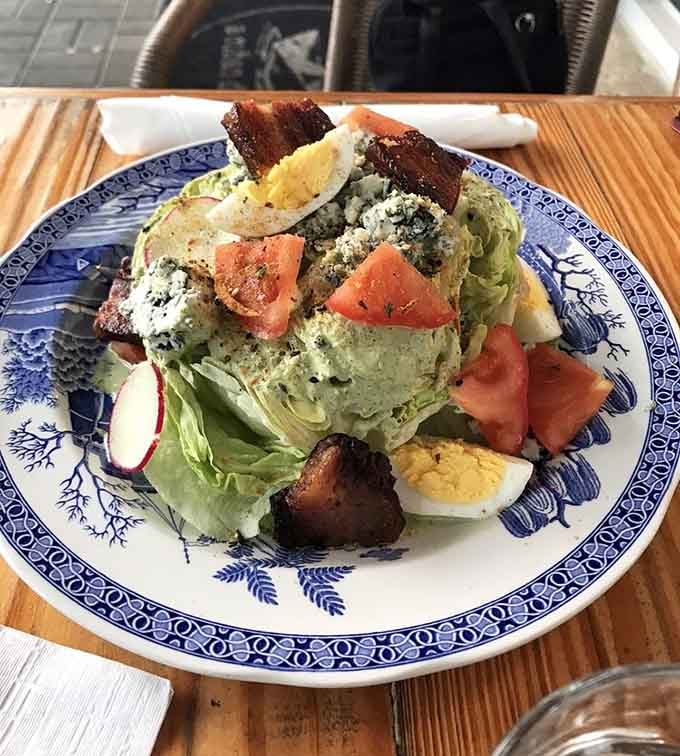 Even the salads here come dressed to impress, complete with bacon and a hard-boiled egg crown.