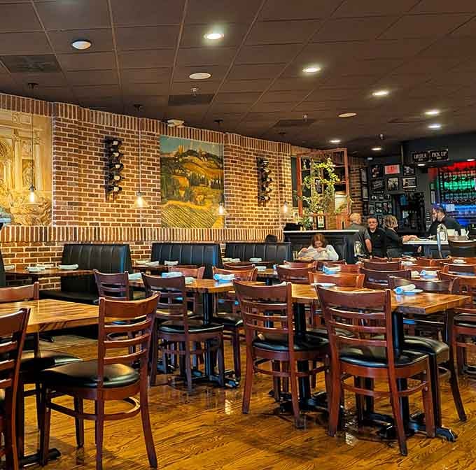 Another angle of the dining room reveals Italian artwork and enough warm ambiance to make any meal feel special.