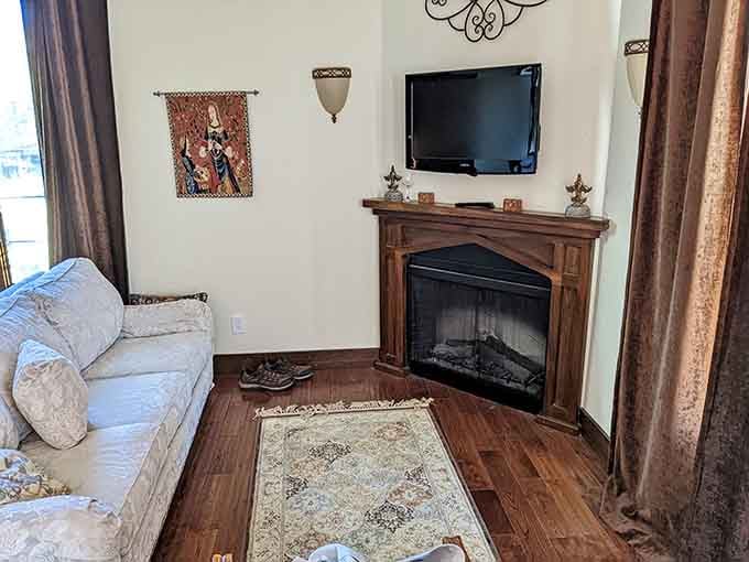 A cozy fireplace corner where you can binge your favorite shows while pretending you're in Downton Abbey.