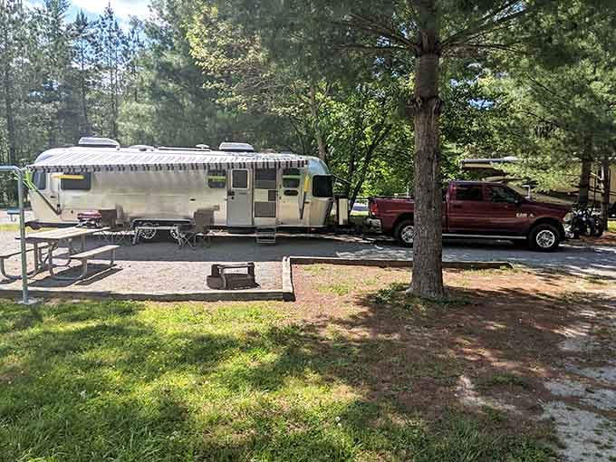 That vintage Airstream knows what's up, claiming prime real estate under the shade trees for summer.