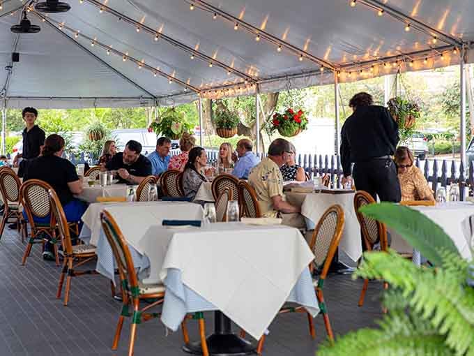 The outdoor tent seating brings alfresco dining to Lexington with style and genuine Kentucky hospitality.