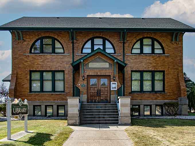 Those arched upper windows and grand entrance stairs represent an era when even small-town libraries were built like temples.