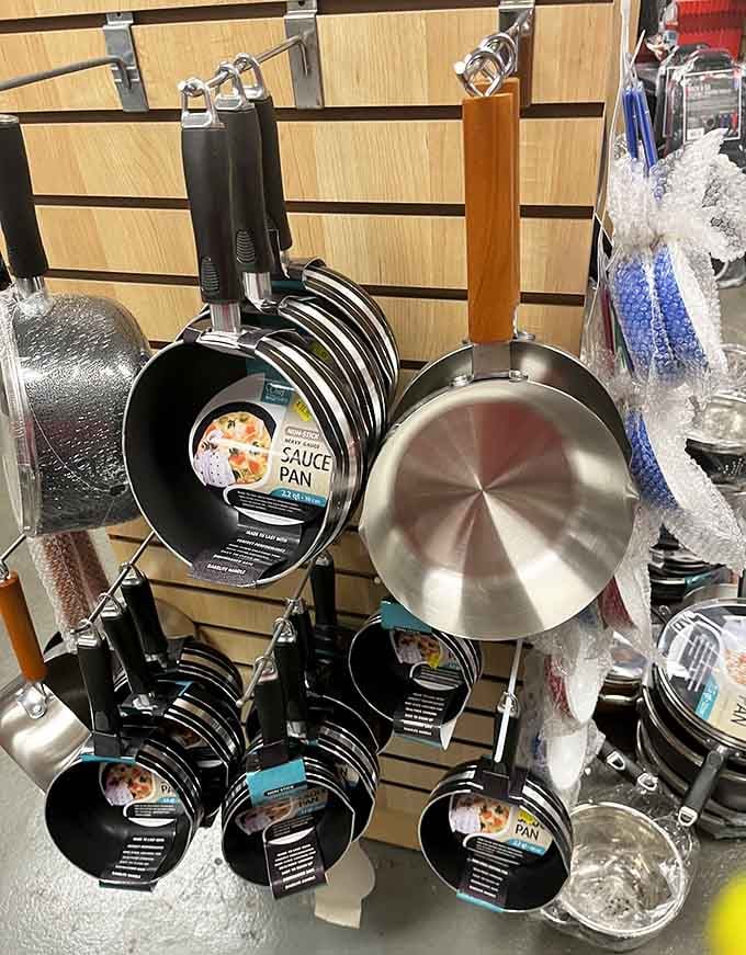 Gleaming cookware hangs like kitchen artwork, ready to replace those scratched pans you've been meaning to upgrade.