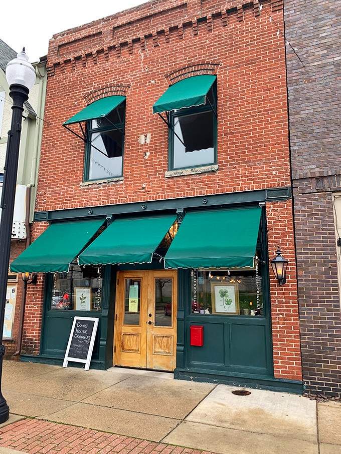 Brick buildings with turquoise awnings and golden wood doors create a streetscape that cameras and Instagram feeds absolutely adore.
