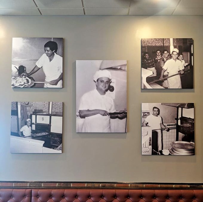 Black and white photographs on the wall honor the pizza makers who built this legendary tradition.