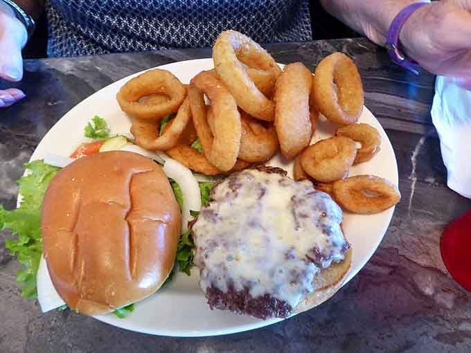 When your burger needs a mountain of onion rings because fries alone just won't cut it today.