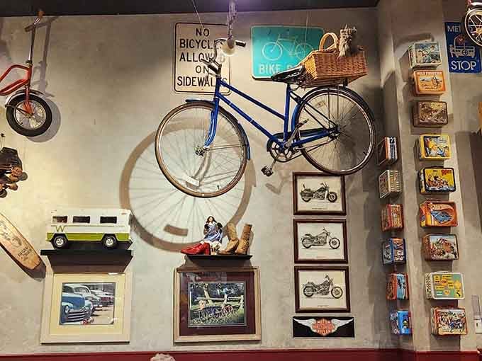 A bicycle on the wall next to a "No Bicycles Allowed" sign is the kind of ironic humor that makes you smile.