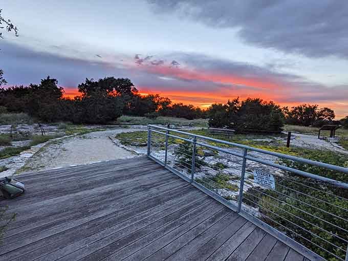 Sunset at the sinkhole paints the sky in colors that make your phone's camera weep with inadequacy and longing.