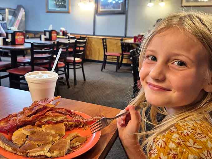 Young diners discovering the joy of unlimited bacon&mdash;a life lesson that'll serve them well forever.