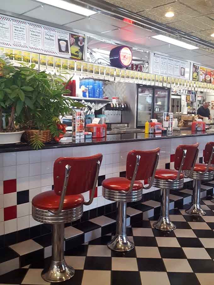 Chrome-trimmed counter stools offer prime viewing for the griddle action&mdash;dinner and a show, essentially speaking.