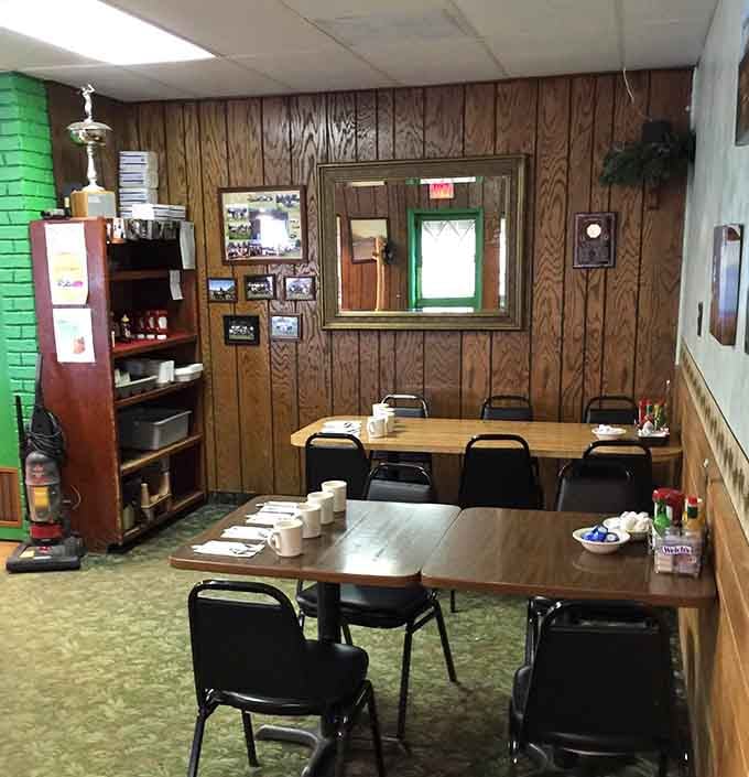 Simple tables and wood paneling create that authentic diner atmosphere where comfort food feels right at home.