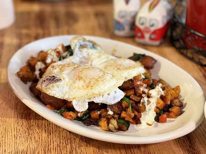 Veggie hash topped with eggs, proving healthy choices can still look like they're trying to win awards.