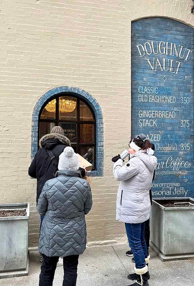 Even in winter coats, these folks know the wait is worth it for what's waiting inside those doors.