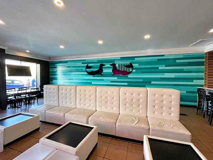 Modern seating and turquoise stripes create a vibe that's equal parts beach club and neighborhood hangout spot.