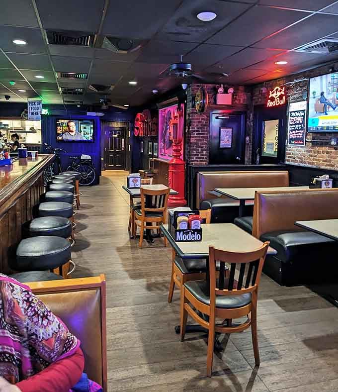 Comfortable booths and bar seating bathed in colorful lighting make this the kind of place where hours disappear faster than your appetizers do.