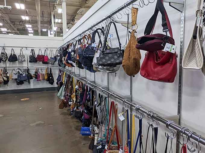 Purses hanging like leather and canvas art, each one with stories from previous owners you'll never know.
