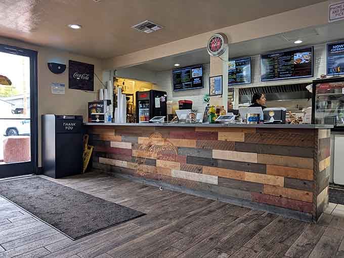 The counter with its reclaimed wood paneling and visible kitchen&mdash;where the magic happens right before your eyes.