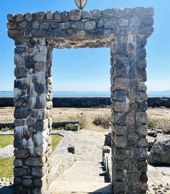 Stone archways framing ocean views, because apparently someone understood that combining architecture with nature creates pure magic every single time.
