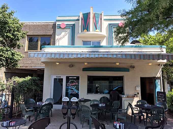 Outdoor seating under that striped awning transforms breakfast into a people-watching event worth attending.