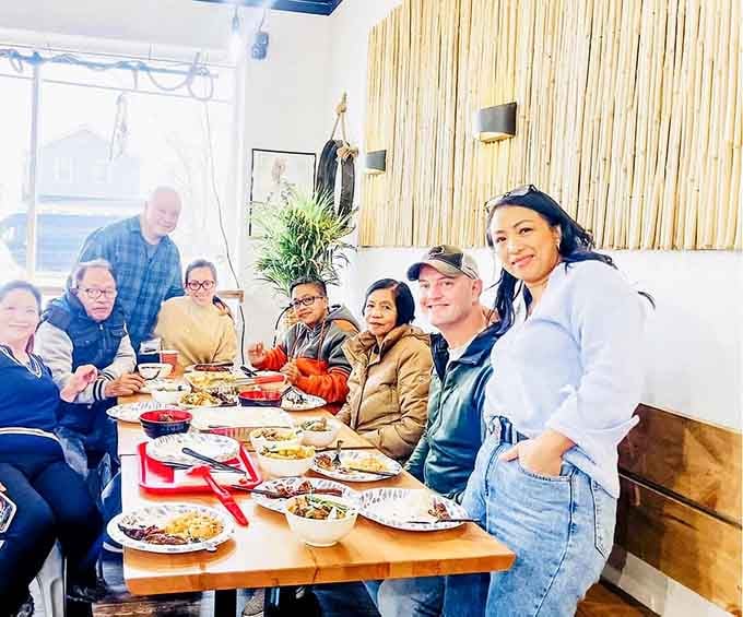Tables full of happy diners sharing plates, exactly how Filipino food was meant to be experienced.