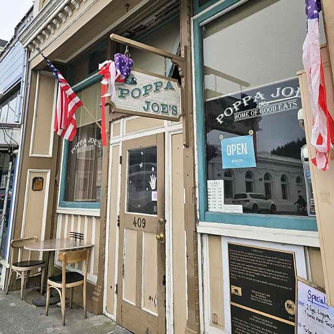 Poppa Joe's storefront welcomes you like an old friend, flags waving and ready for good eats.
