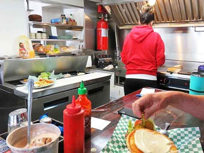 Behind the scenes, skilled hands craft the legendary treats that keep people driving back for more.