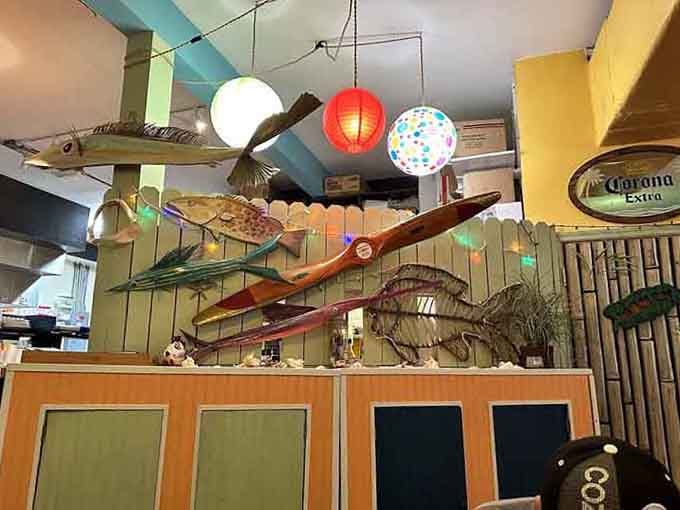 Ceiling decorations featuring fish and colorful lanterns that scream "beach party" louder than any Jimmy Buffett song ever could.