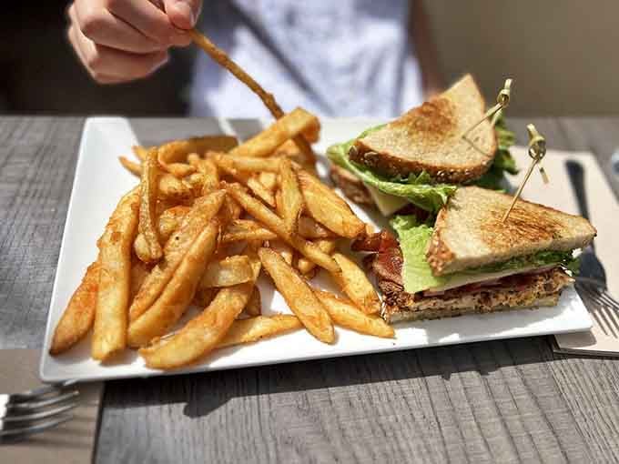 That salmon BLT with crispy fries looks substantial enough to ground you before any supernatural encounters you might experience.