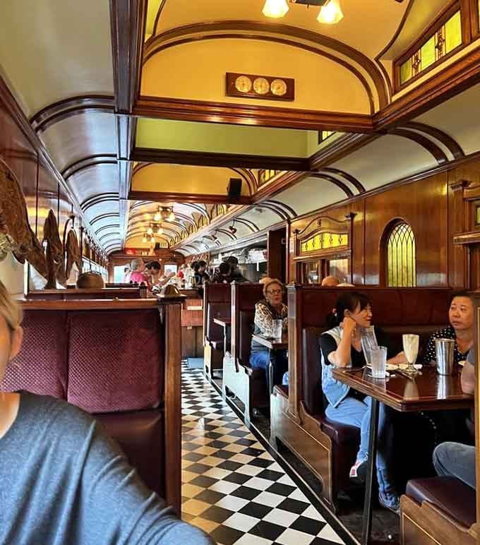 Diners packed into cozy booths, sharing this unique space like they're all in on the same wonderful secret.