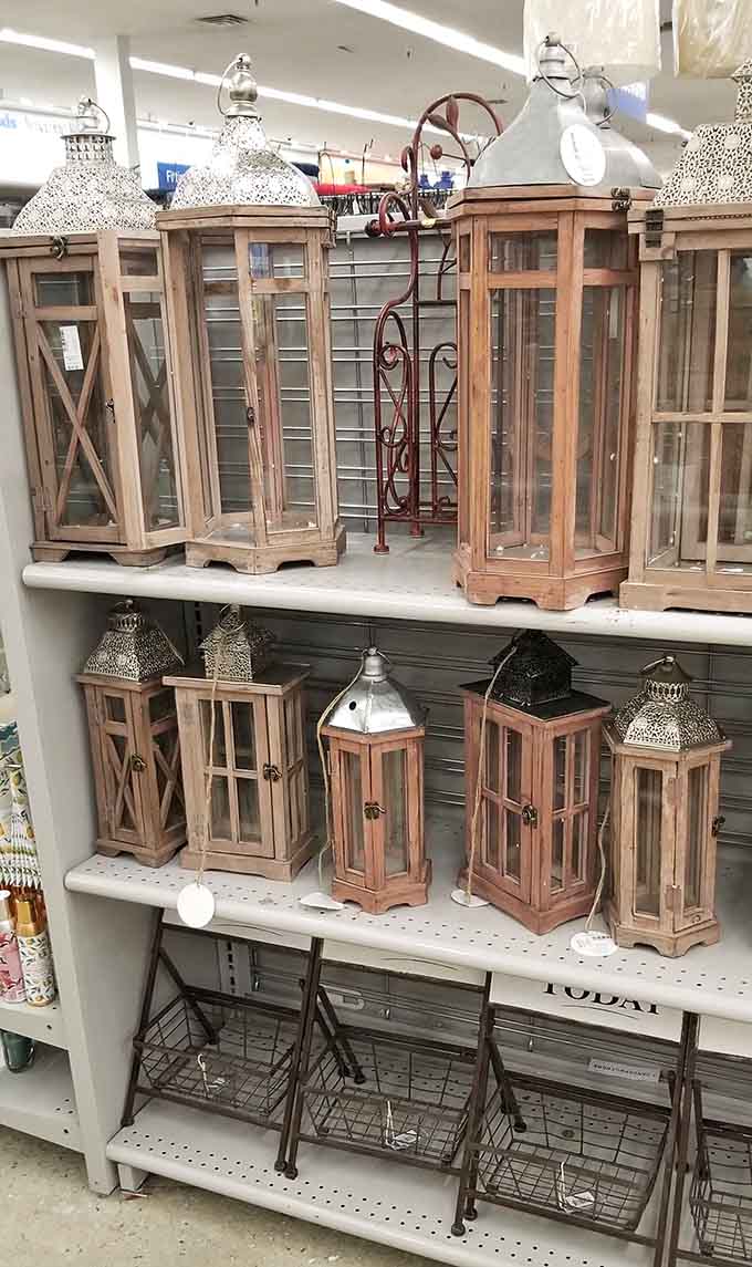 Rustic wooden lanterns add that farmhouse chic vibe everyone's been pinning on Pinterest for years now.