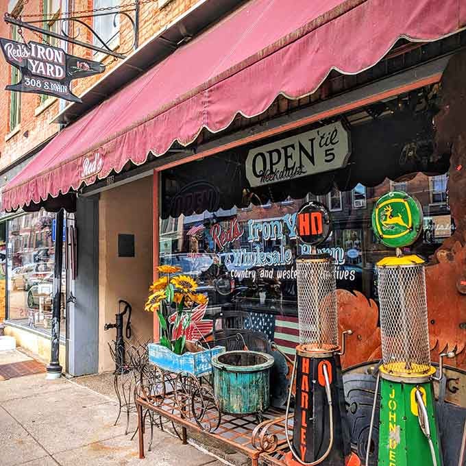 Red's Iron Yard displays vintage Americana out front, turning the sidewalk into a nostalgic treasure hunt before you enter.