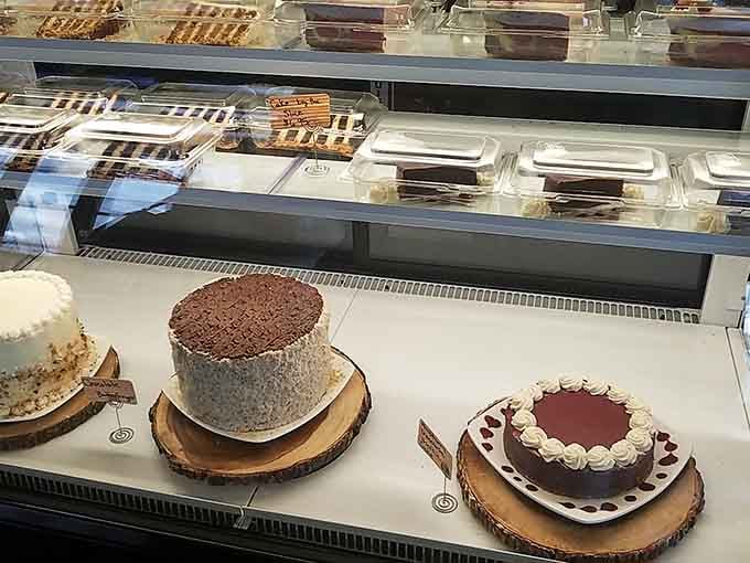 The dessert case displays tempting cakes that make choosing just one feel like an impossible decision you're happy to face.