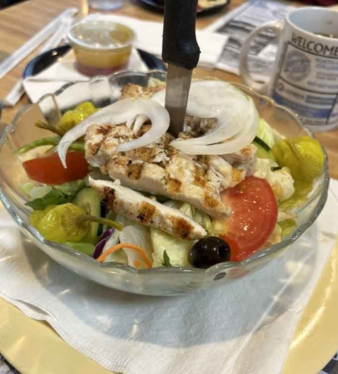 Fresh, crisp, and topped with grilled chicken&mdash;proof that George's does healthy just as well as indulgent.