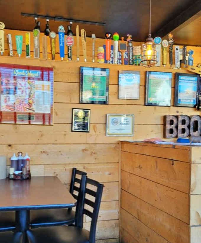 Beer taps lined up like soldiers, ready to complement whatever smoky masterpiece you're about to devour.